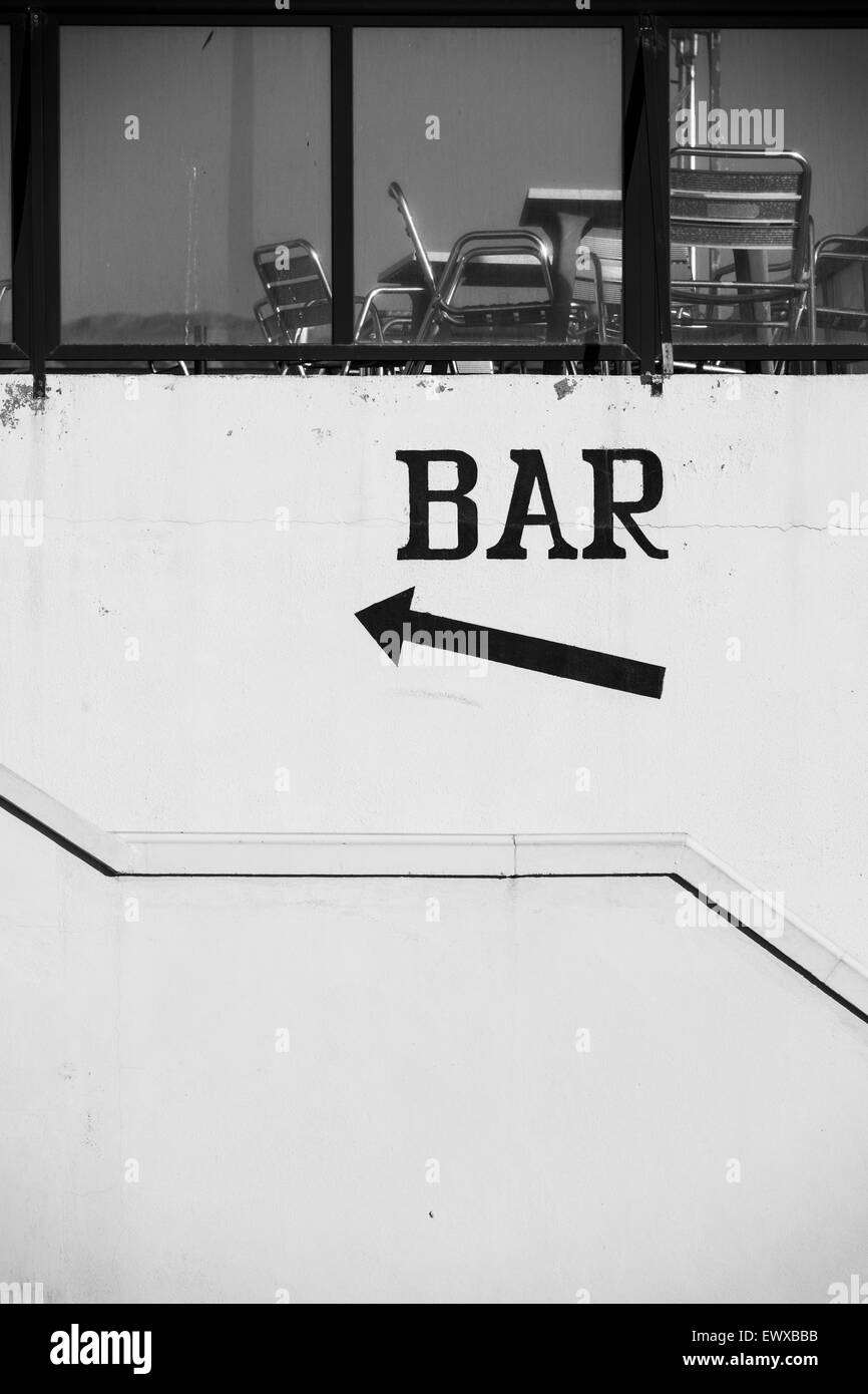 Bar sign pointing towards a roof terrace Stock Photo - Alamy