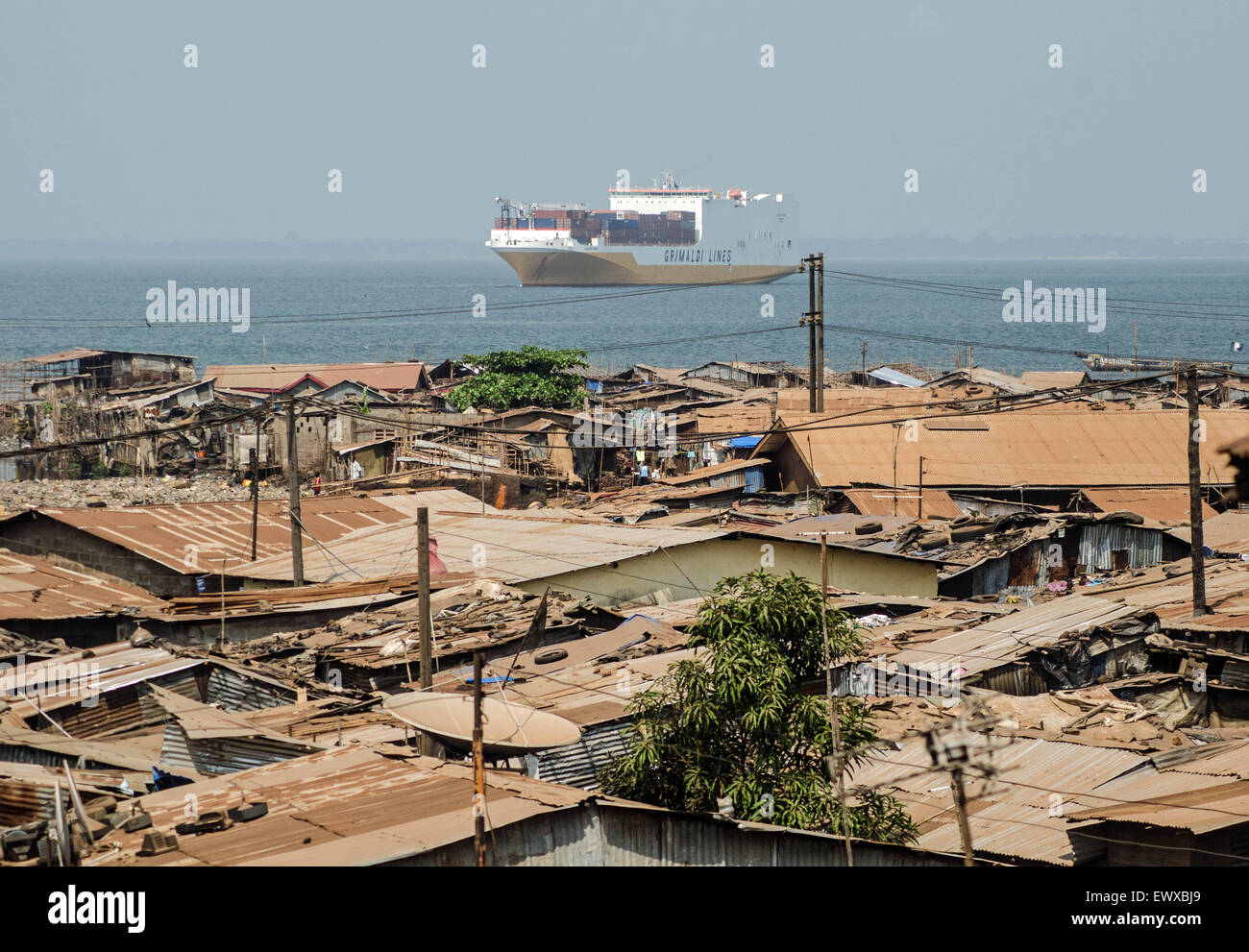 A cargo ship seen above Kroo bay slum in Freetown, Sierra Leone Stock ...