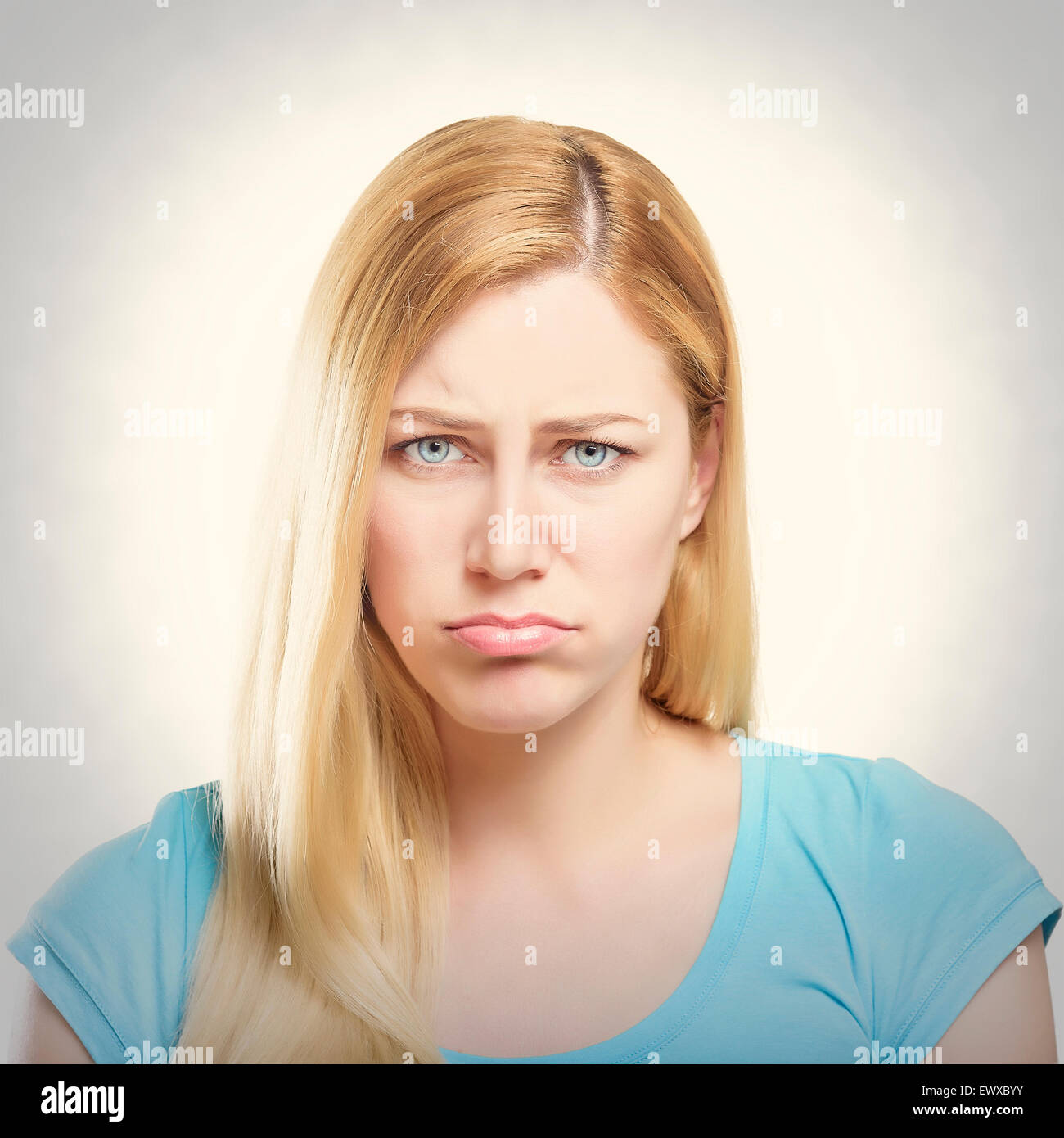 PoBlonde woman making pout Stock Photo - Alamy