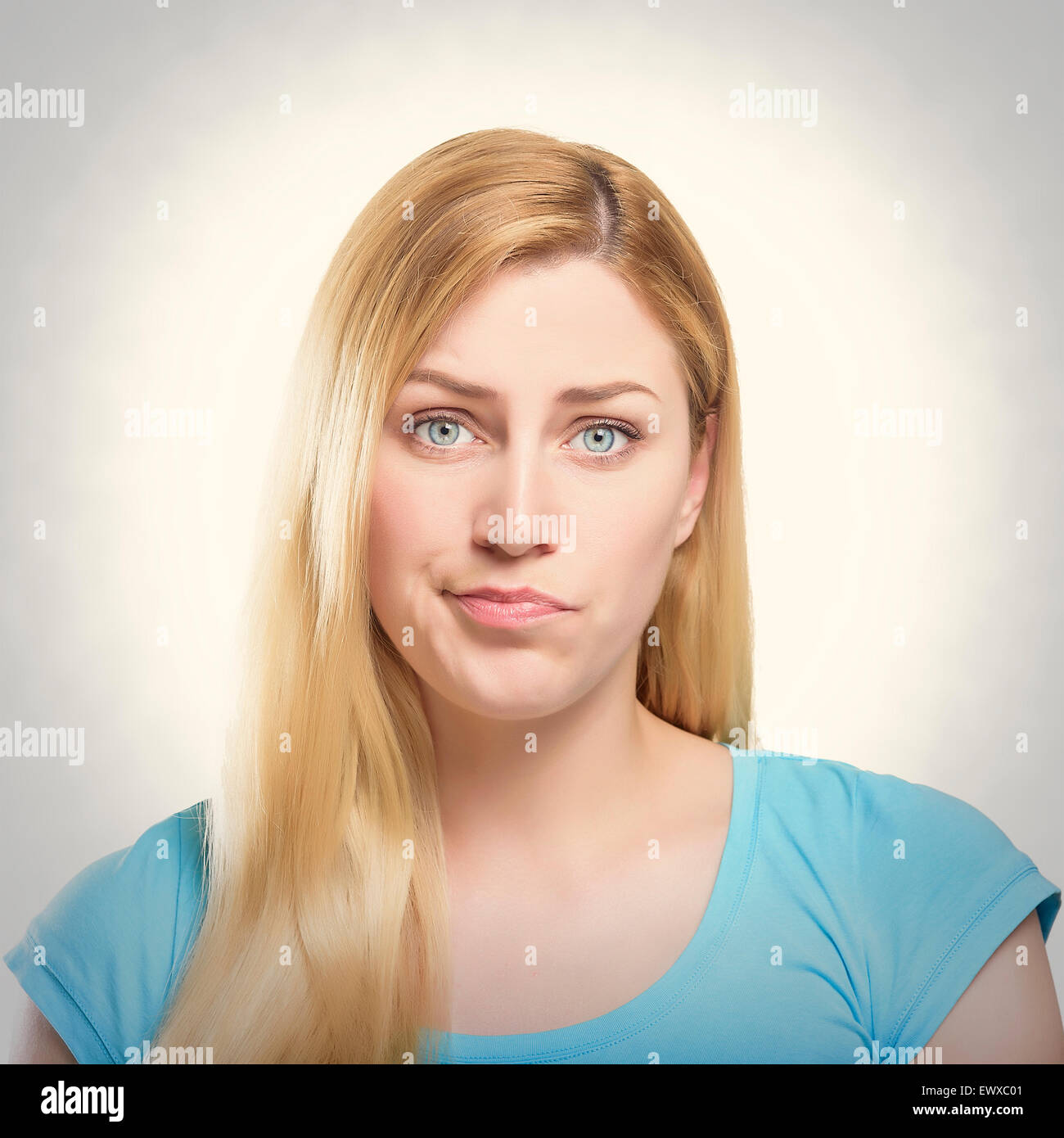 PoBlonde woman making pout Stock Photo - Alamy