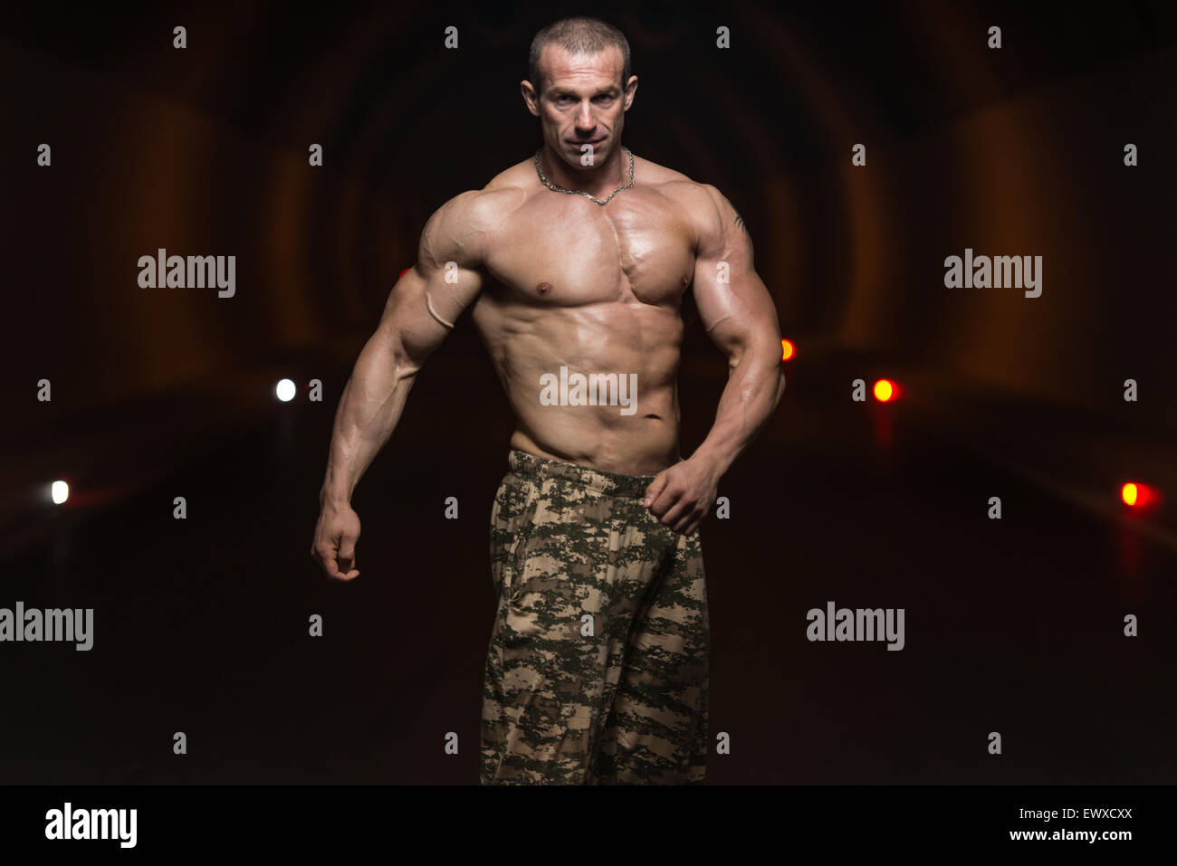 Male Bodybuilder Flexing Muscles Side High Resolution Stock Photography ...