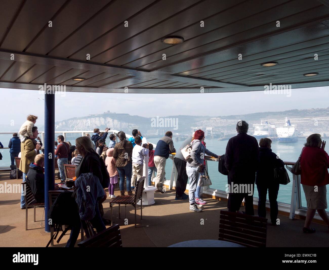 Lots of people on the deck of a Ferry leaving port Stock Photo - Alamy