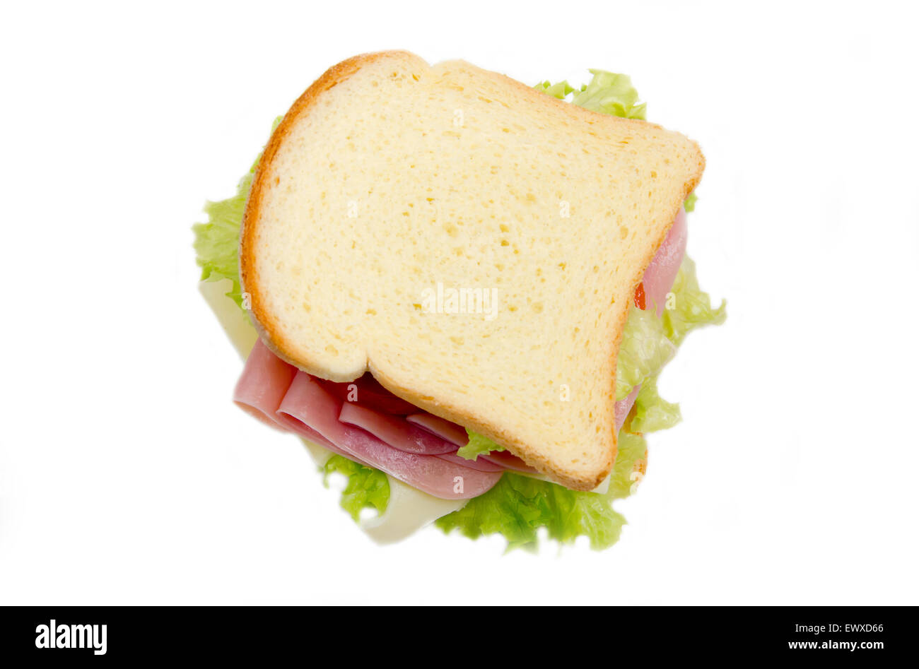 Slices of bread with ham and salad on white background seen from above ...
