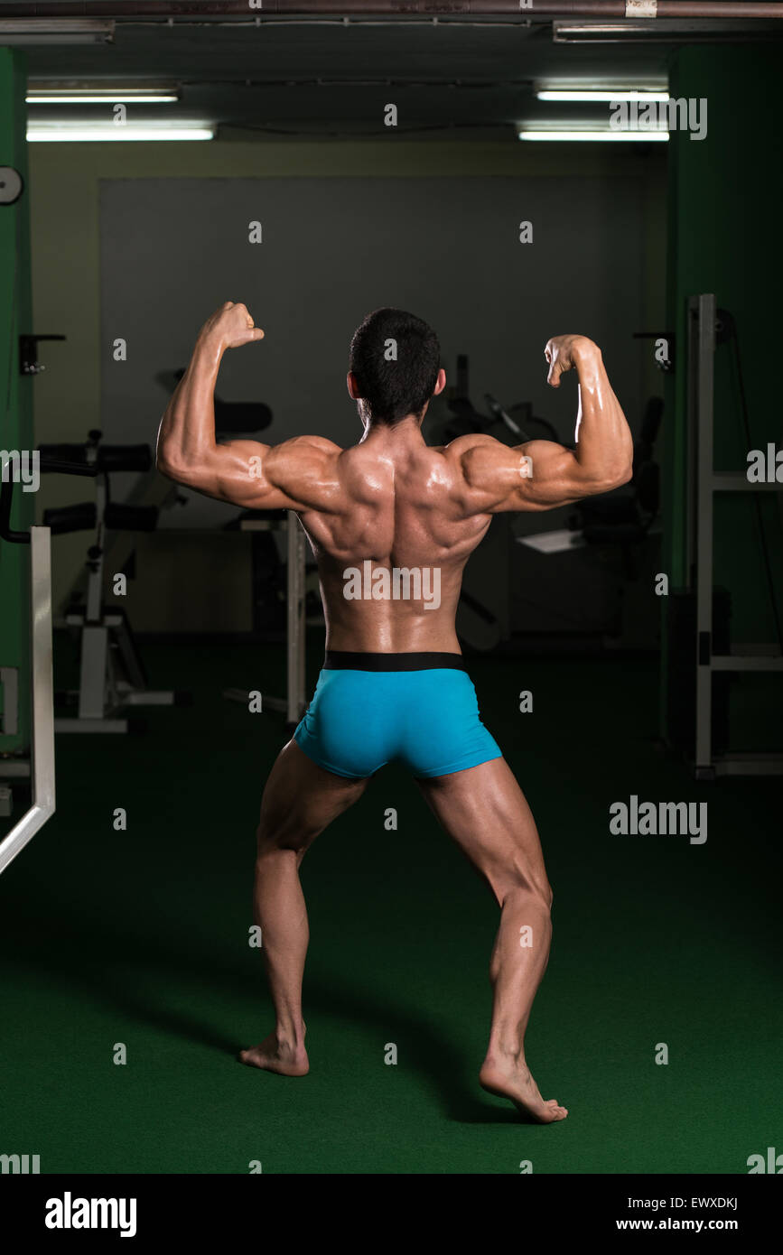 Body Builder Performing Rear Double Biceps Poses Stock Photo - Alamy