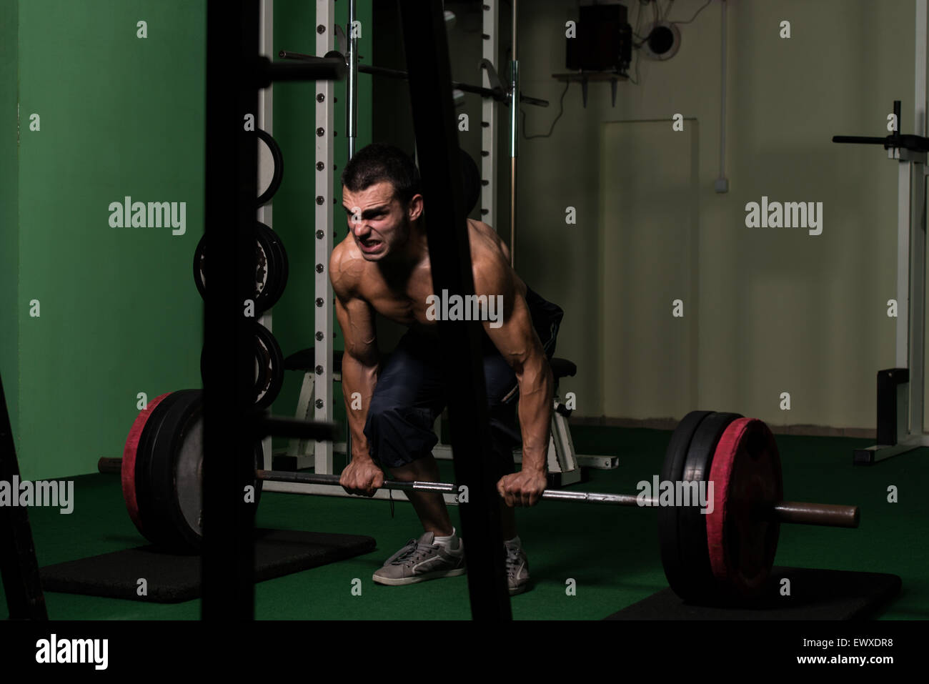 Muscular Man Lifting Dead Lift In The Gym Stock Photo - Alamy