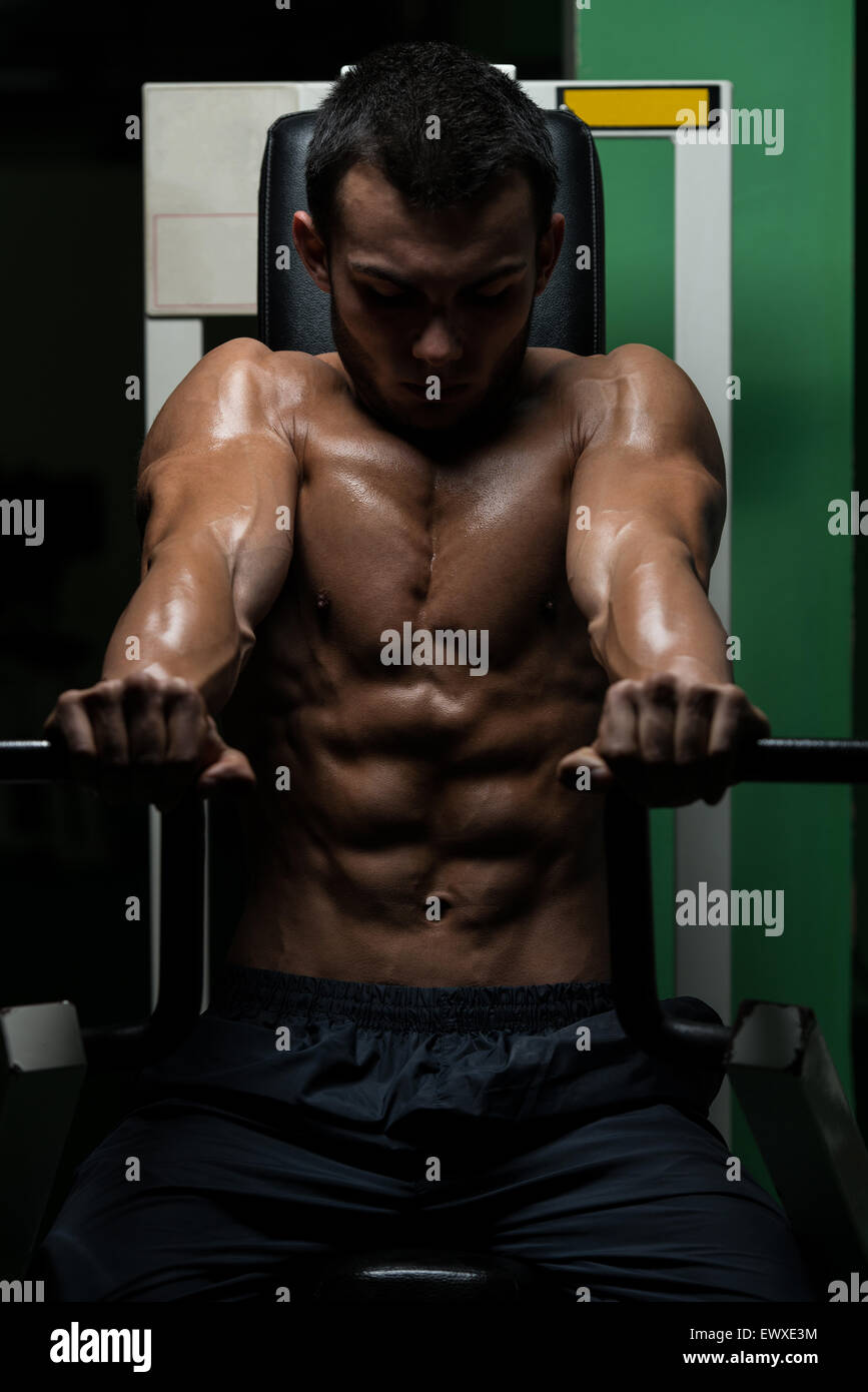 Young Man Doing Heavy Weight Exercise For Chest Stock Photo - Alamy