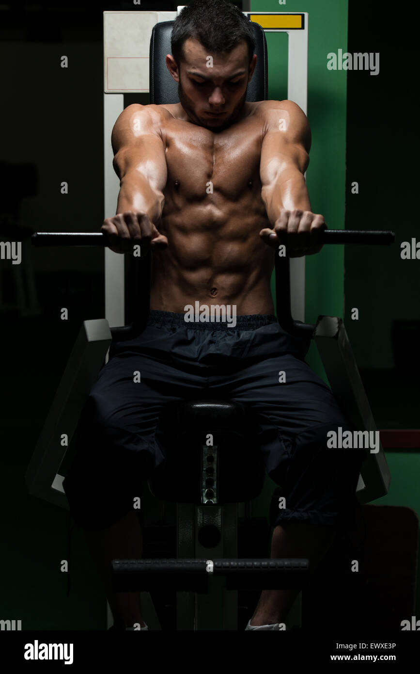Young Man Doing Heavy Weight Exercise For Chest Stock Photo - Alamy