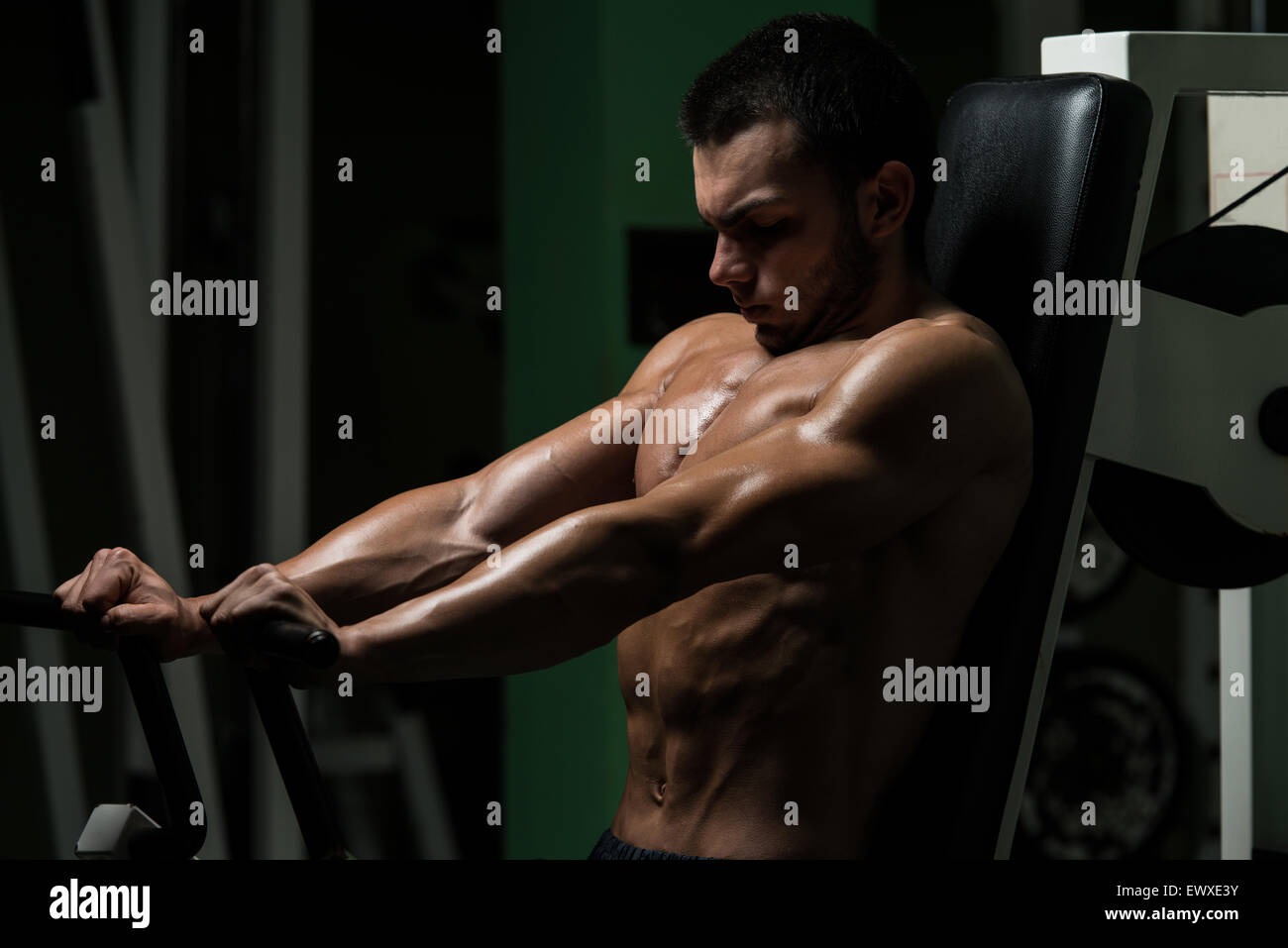 Young Man Doing Heavy Weight Exercise For Chest Stock Photo - Alamy