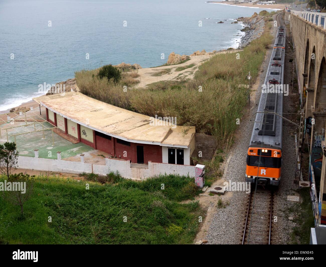 Train passing by a beach in Spain Stock Photo - Alamy