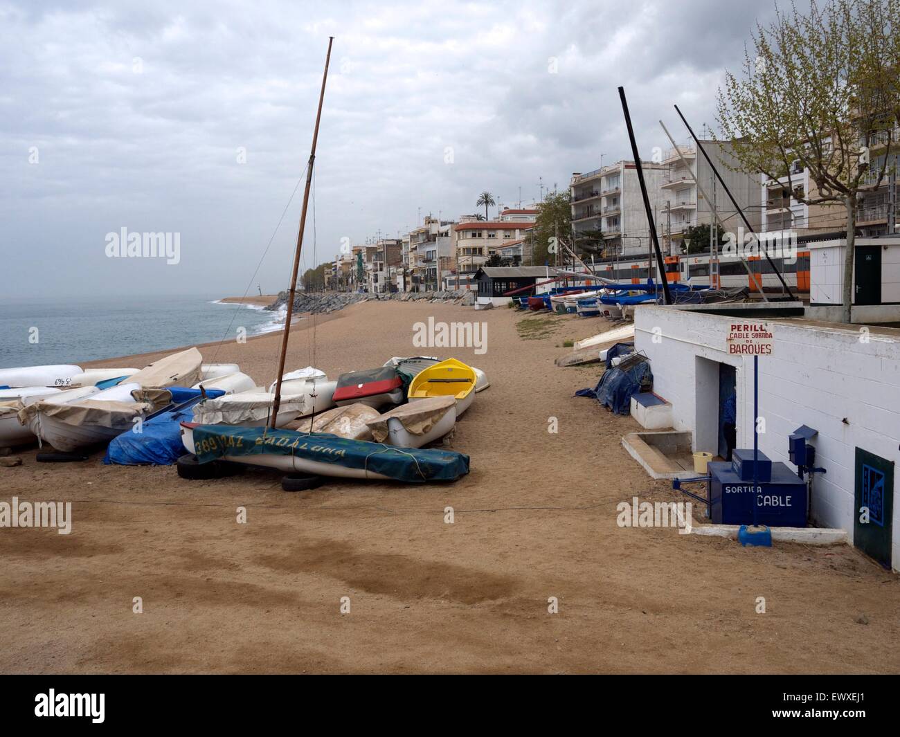 Fishing and rowing boats on a beach in Spain Stock Photo - Alamy