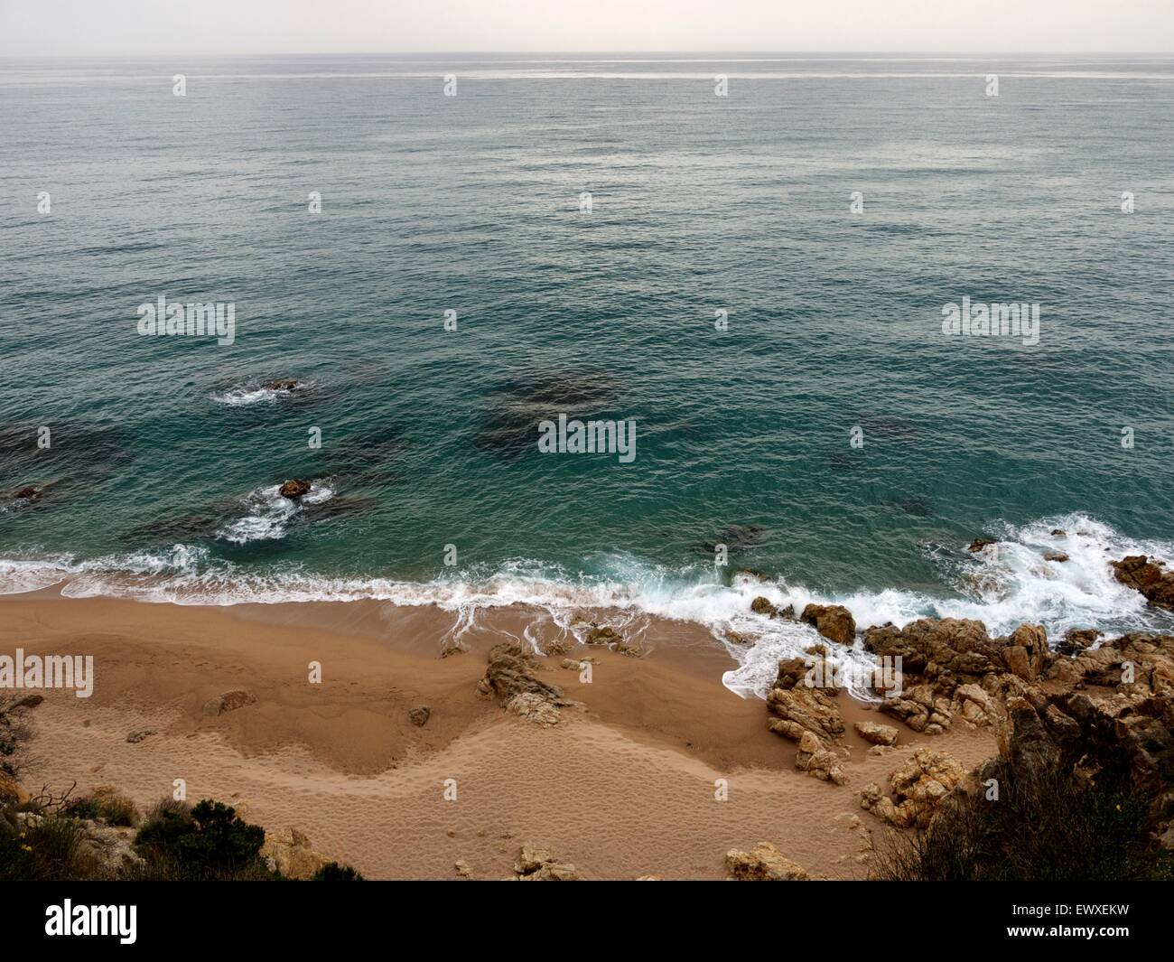 Beach with a clear looking ocean Stock Photo - Alamy