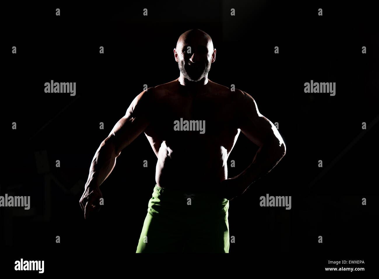 Old man flexing muscles hi-res stock photography and images - Alamy