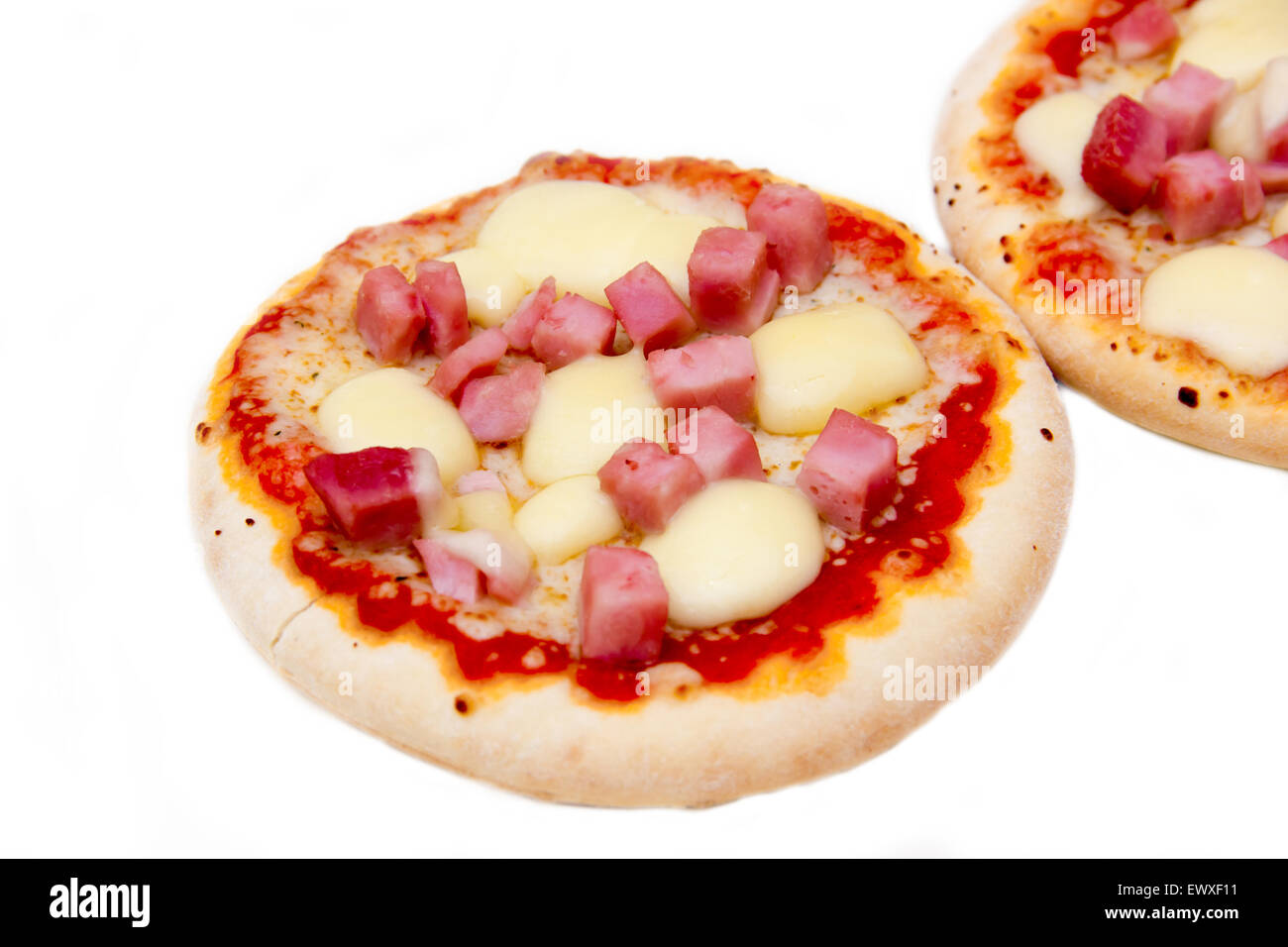 Mini pizzas with ham on white background Stock Photo - Alamy