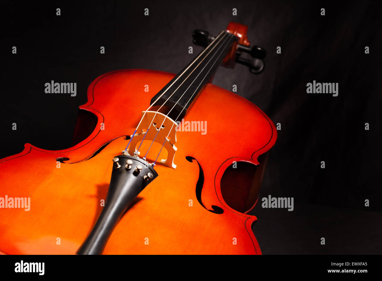 Violoncello body view on the black background Stock Photo - Alamy