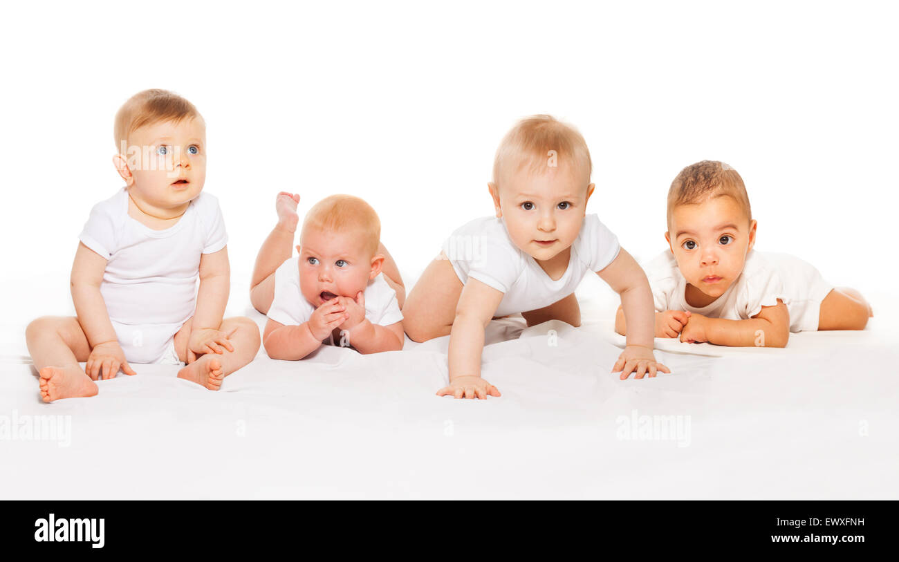 Cute babies crawl in a row wearing white bodysuit Stock Photo - Alamy