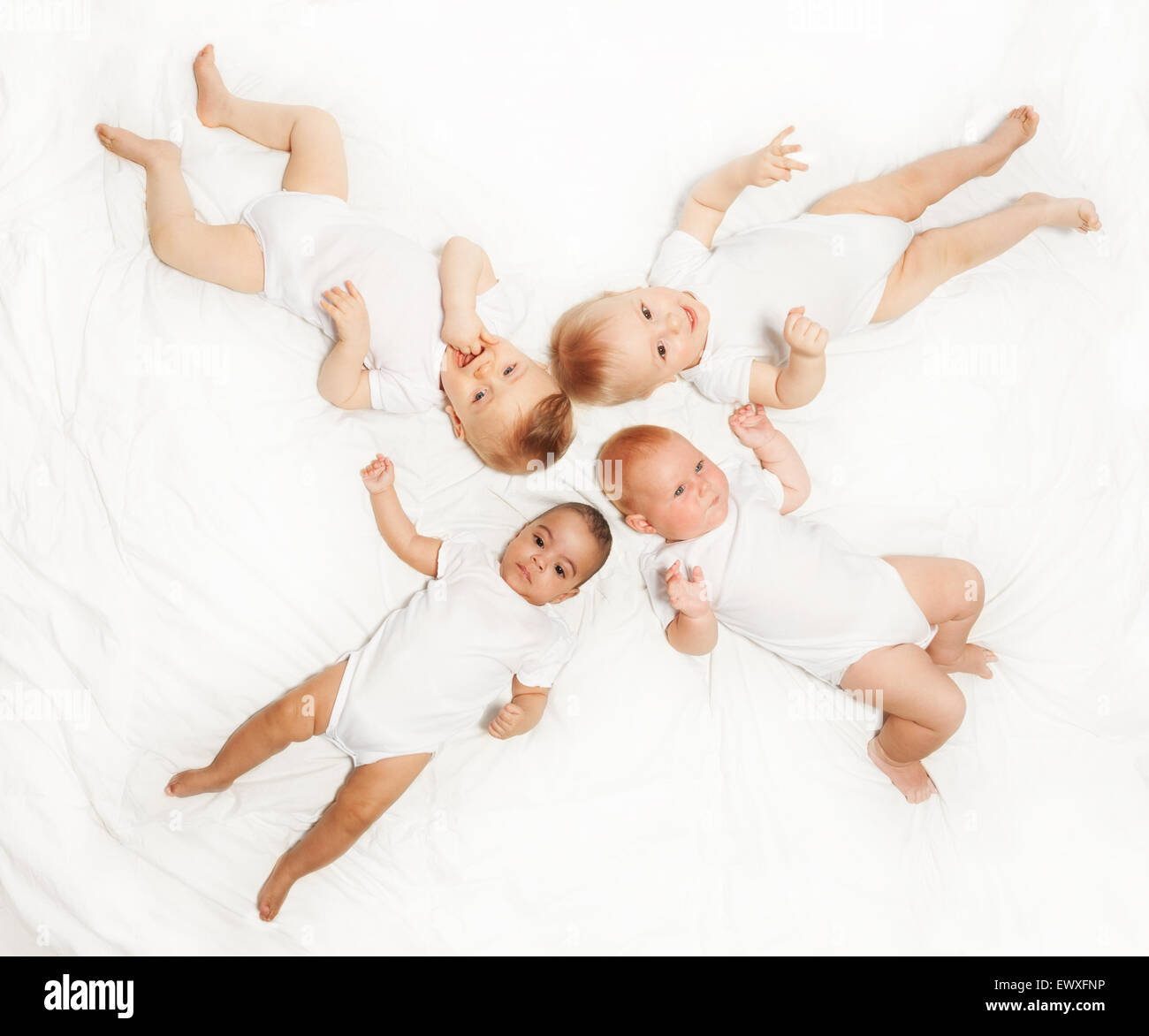 Four adorable children in white hi-res stock photography and images - Alamy