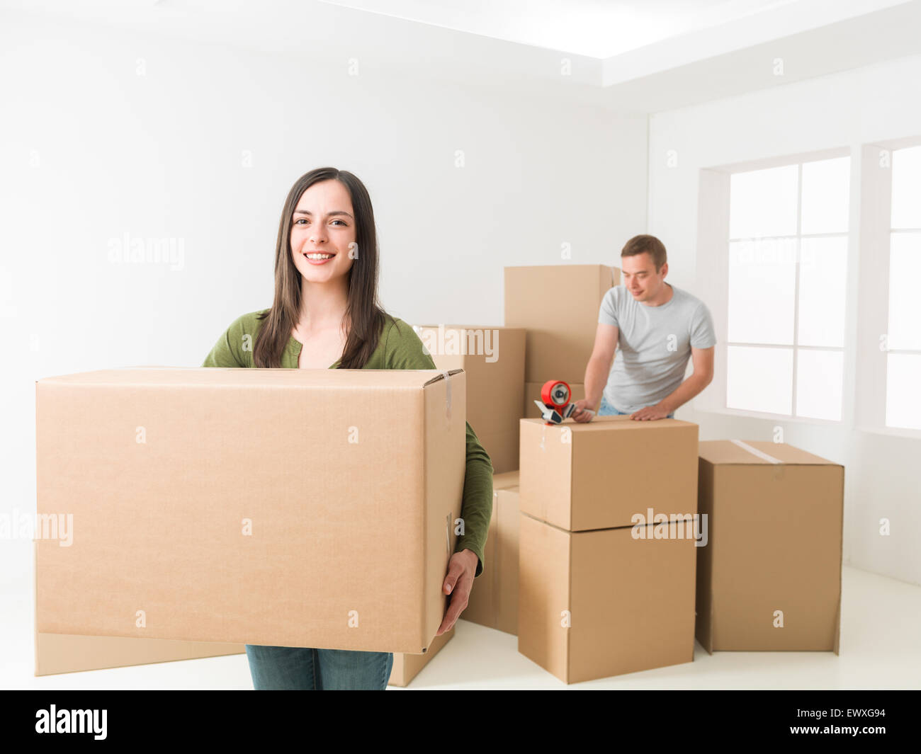 happy young couple packing, preparing to move house Stock Photo - Alamy