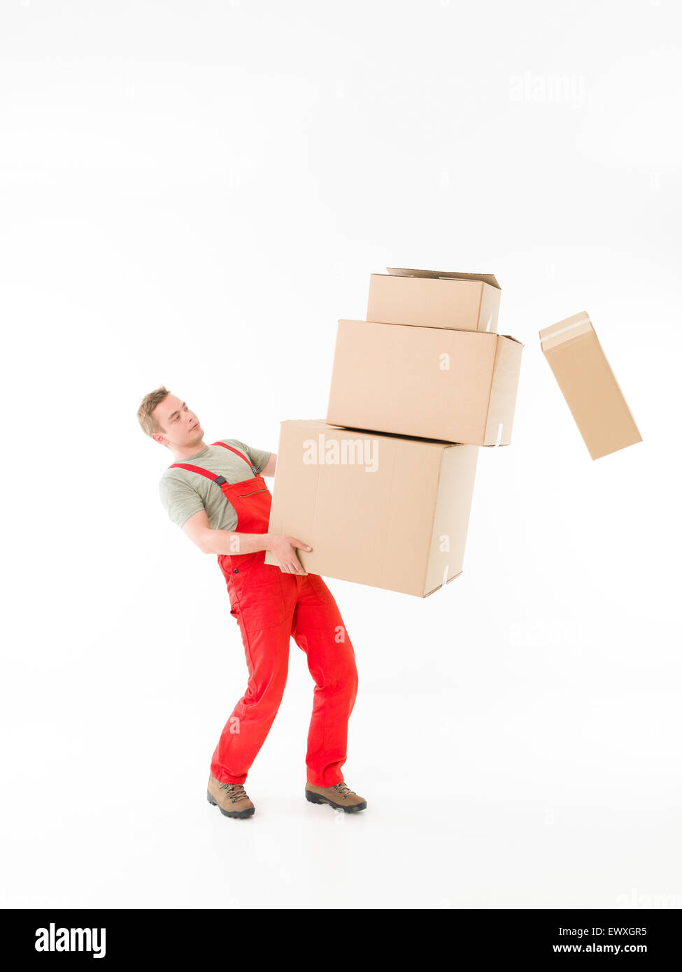 Delivery man falling stack boxes hi-res stock photography and images ...