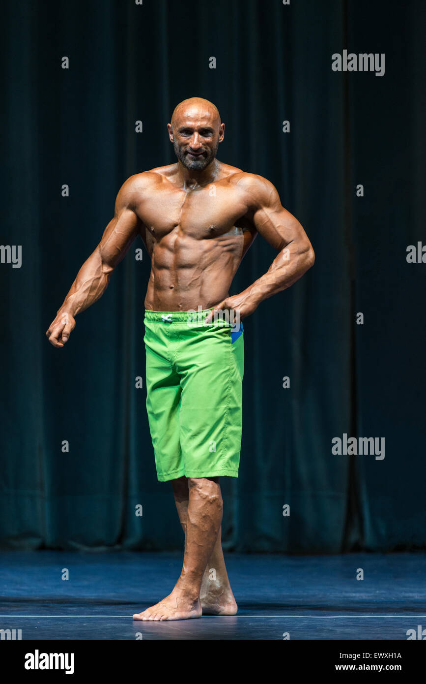 Bodybuilder On A competition For The Win - Front Poses Stock Photo - Alamy