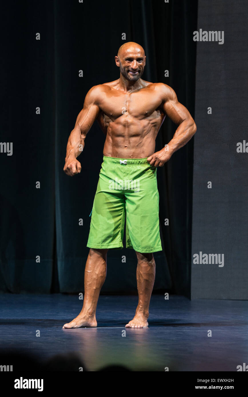 Bodybuilder On A competition For The Win - Front Poses Stock Photo - Alamy