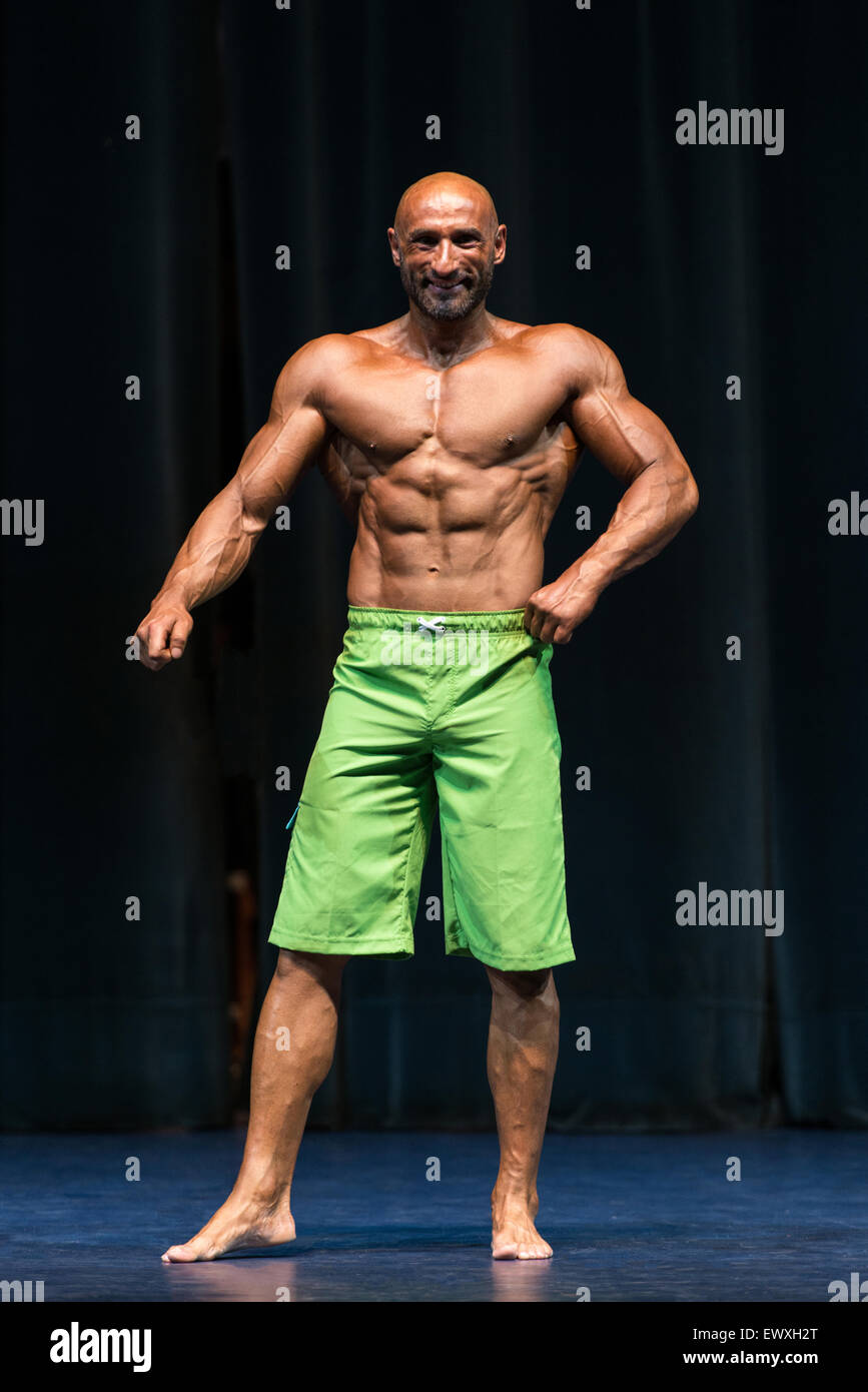 Bodybuilder On A competition For The Win - Front Poses Stock Photo - Alamy