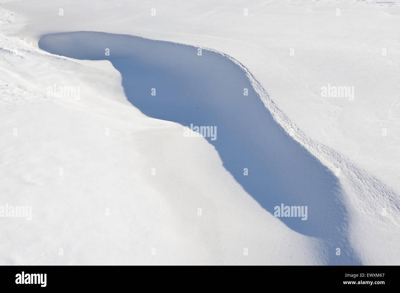 Thin crust of ice over snow Stock Photo - Alamy