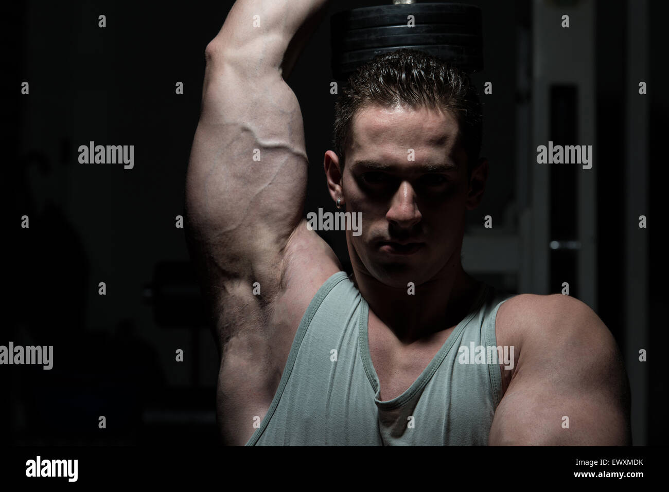 Young Bodybuilder Exercise Triceps In The Gym Stock Photo - Alamy