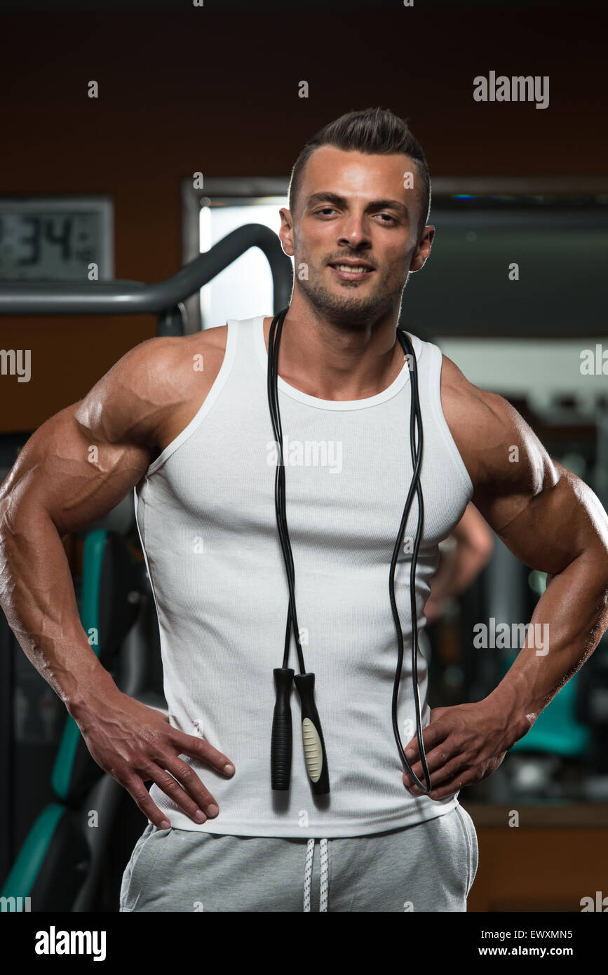 Handsome Muscular Man With Jumping Rope - Cardio Time Stock Photo - Alamy