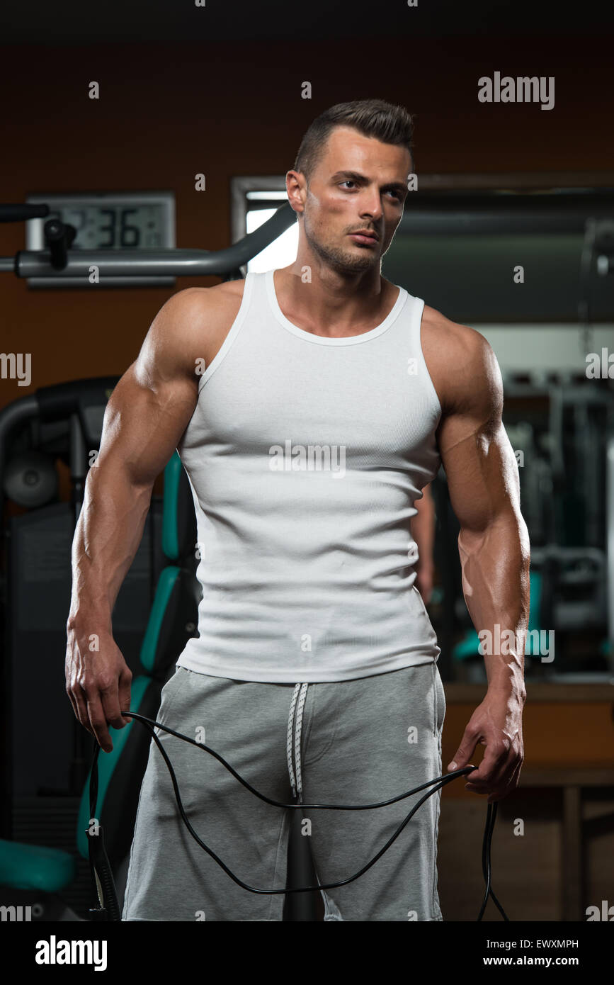 Handsome Muscular Man With Jumping Rope - Cardio Time Stock Photo - Alamy