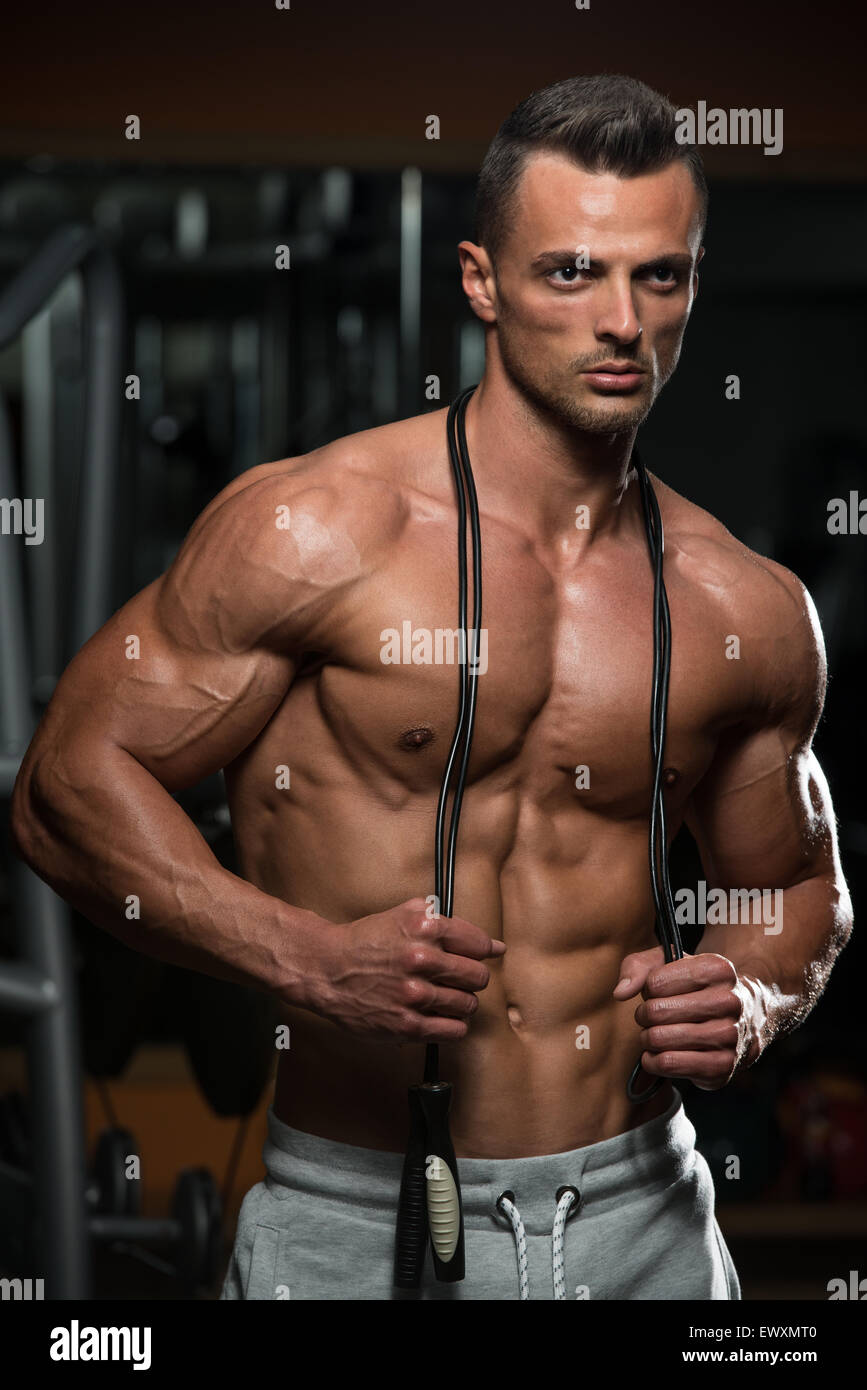 Handsome Muscular Man With Jumping Rope - Cardio Time Stock Photo - Alamy