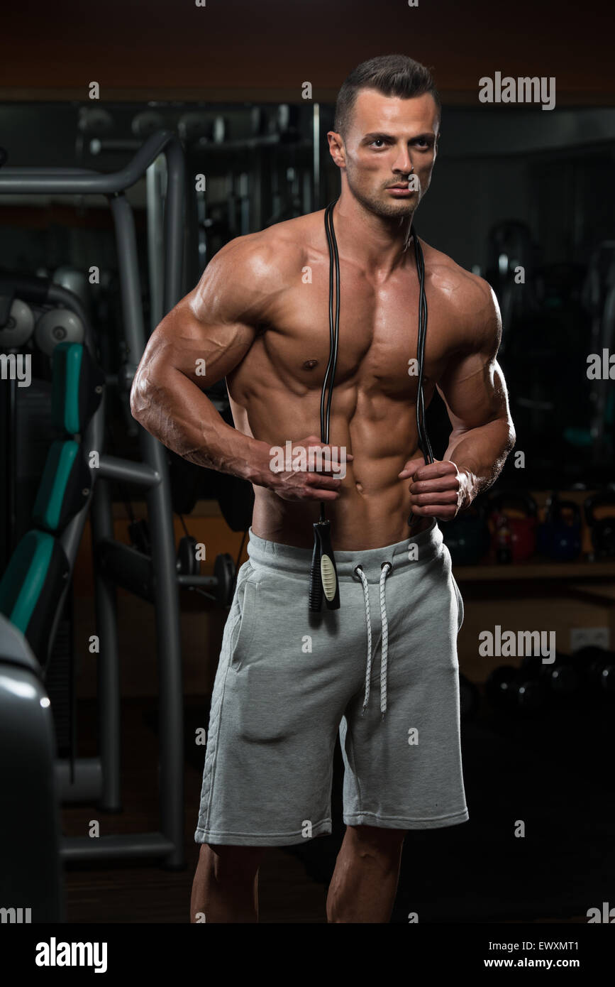 Handsome Muscular Man With Jumping Rope - Cardio Time Stock Photo - Alamy