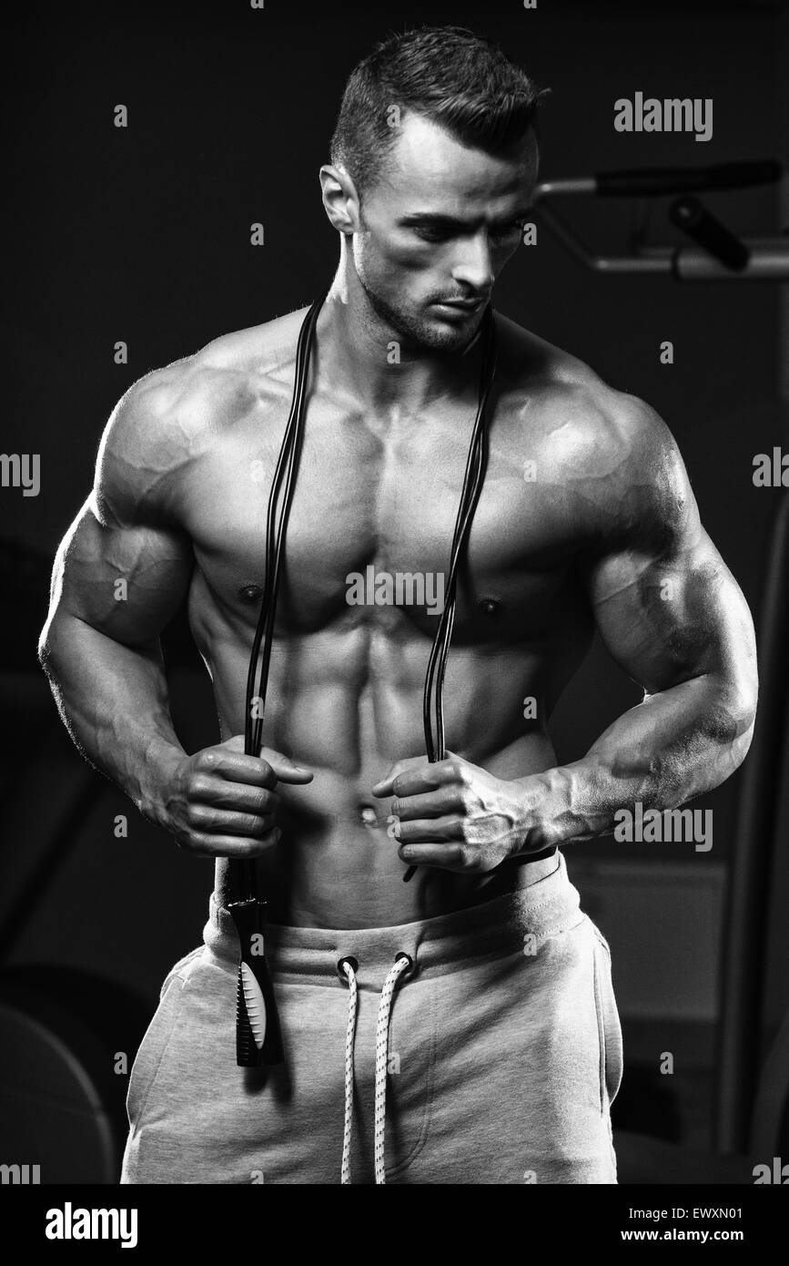 Handsome Muscular Man With Jumping Rope - Cardio Time Stock Photo - Alamy