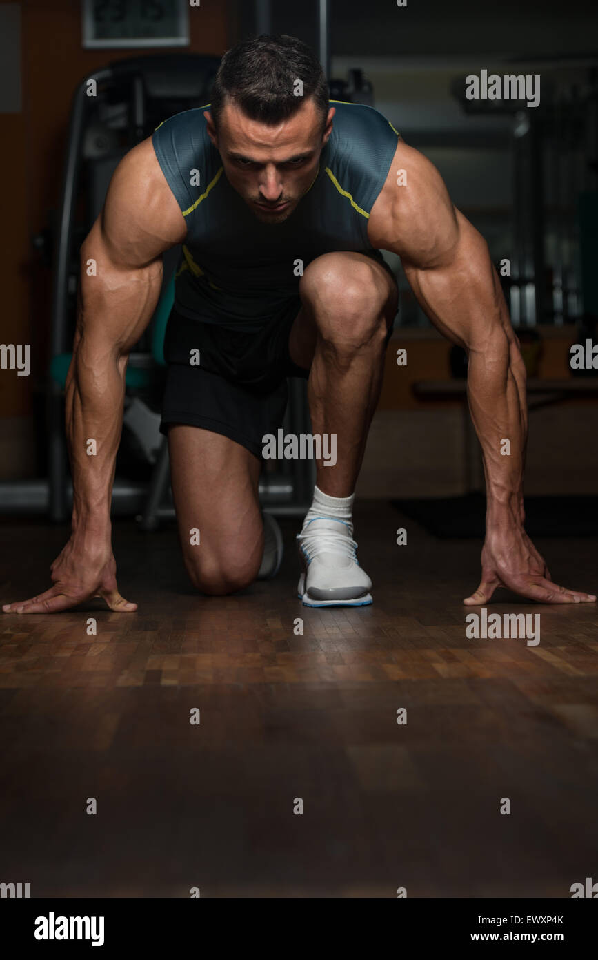 Strong muscular men kneeling on hi-res stock photography and images - Alamy