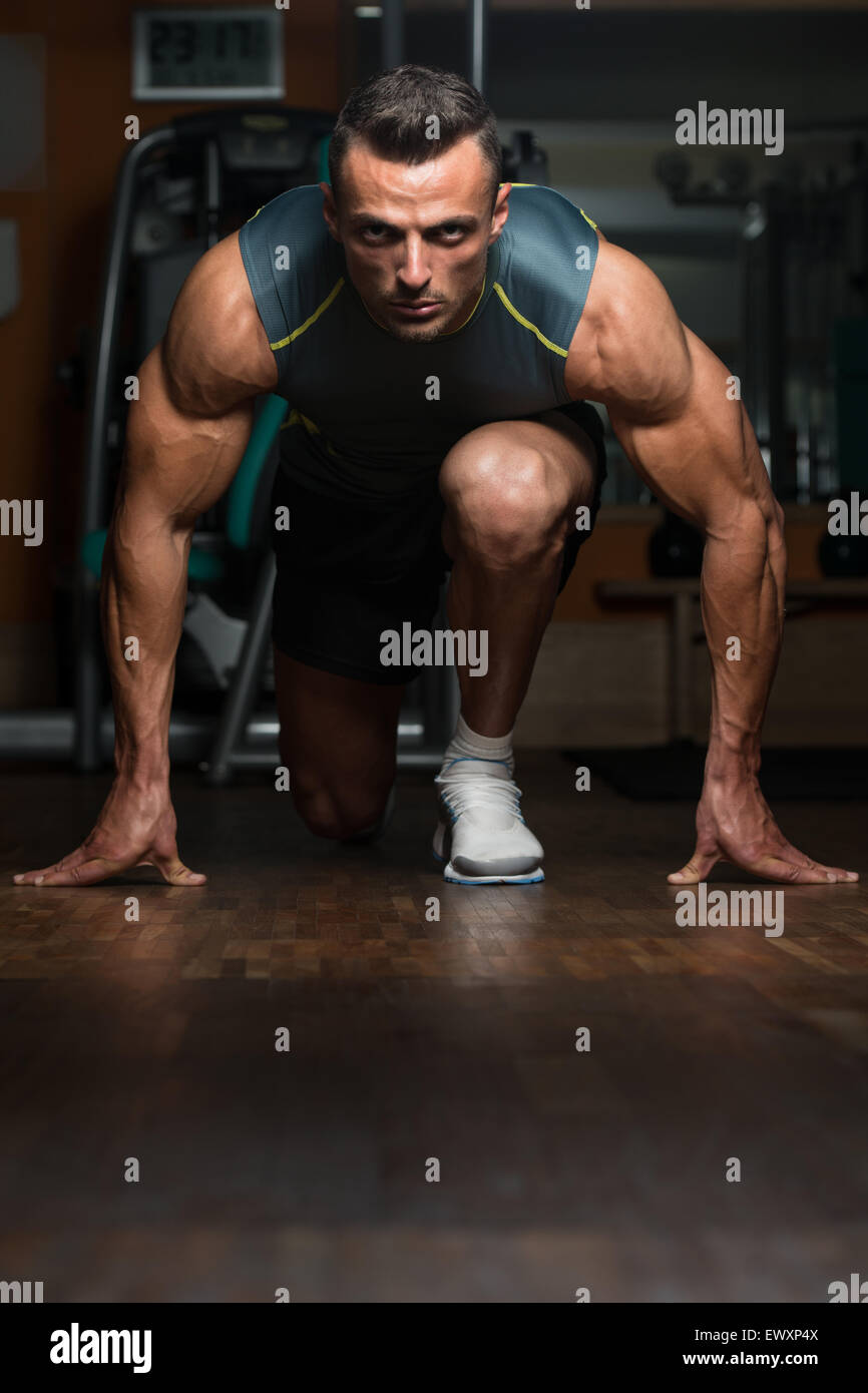 Strong muscular men kneeling on hi-res stock photography and images - Alamy