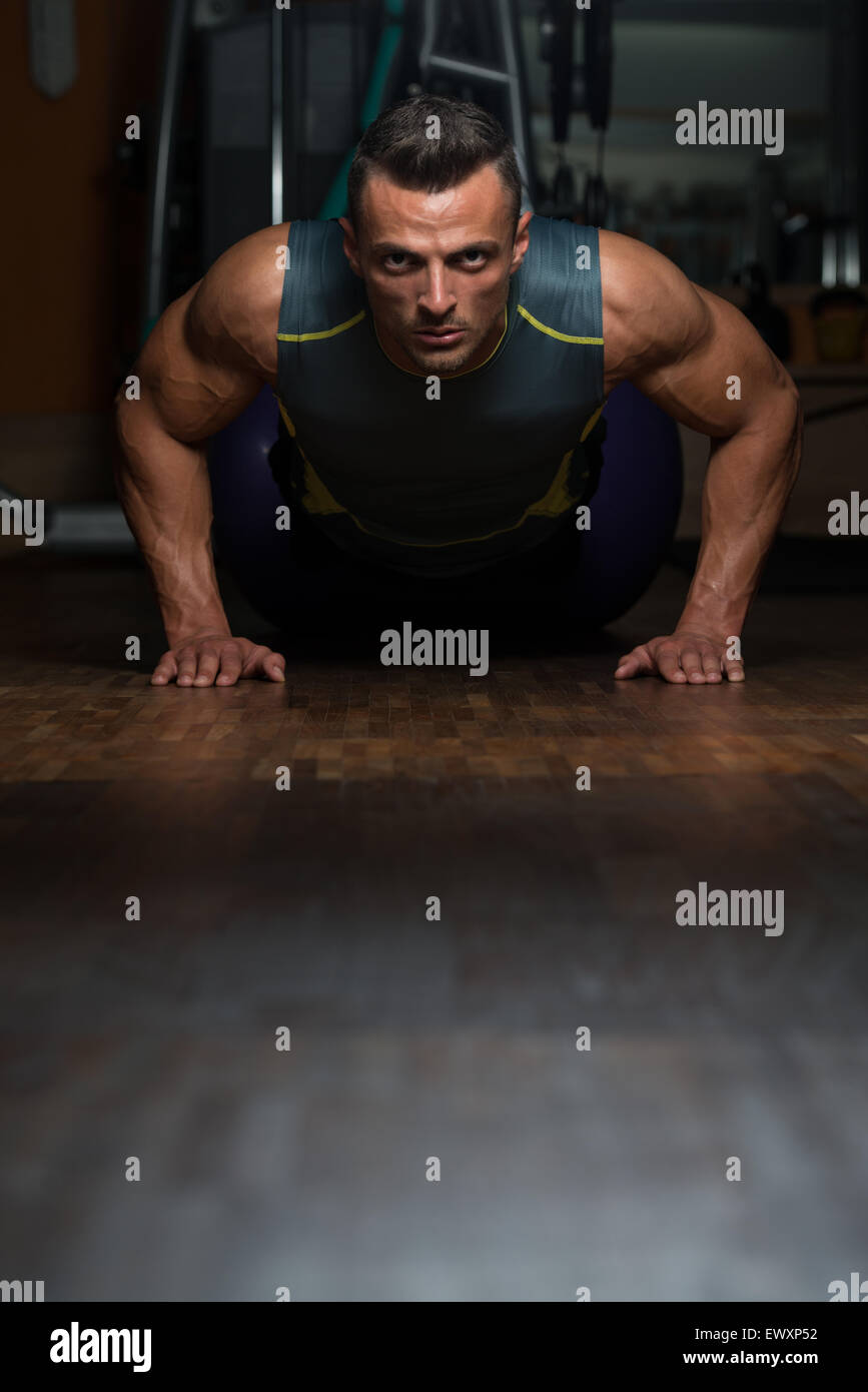 Young Athlete Doing Pushups As Part Of Bodybuilding Training Stock ...