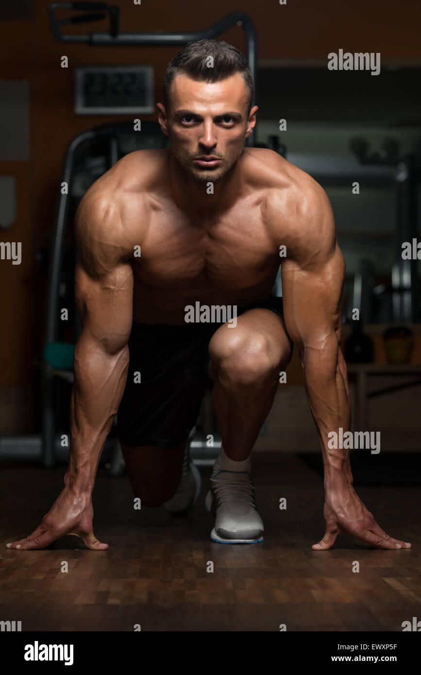 Strong muscular men kneeling on hi-res stock photography and images - Alamy
