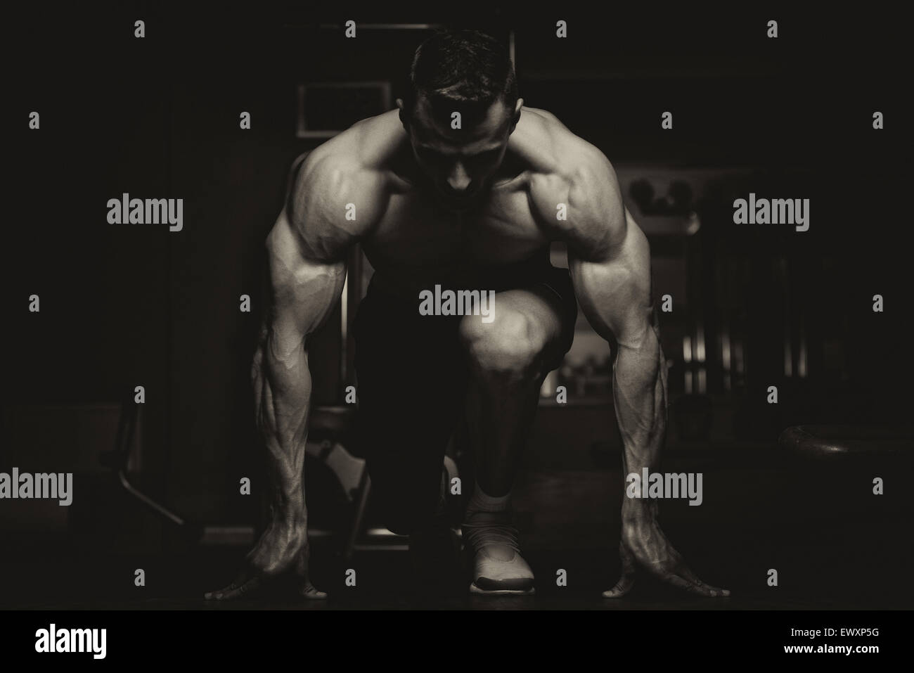 Strong muscular men kneeling on hi-res stock photography and images - Alamy
