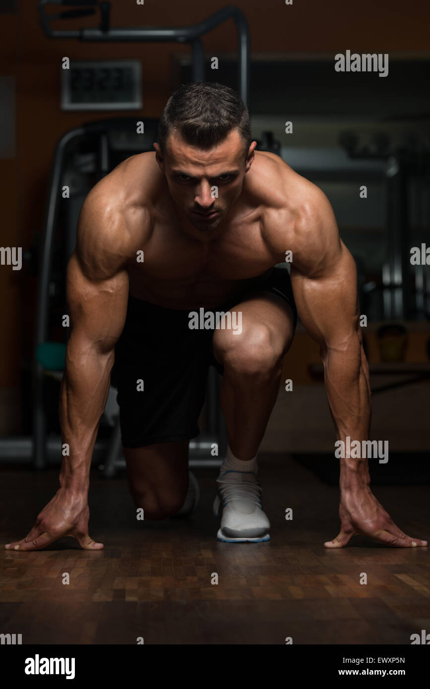 Strong muscular men kneeling on hi-res stock photography and images - Alamy