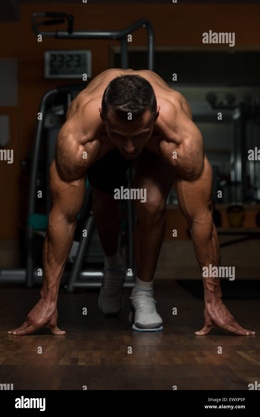 Strong muscular men kneeling on hi-res stock photography and images - Alamy