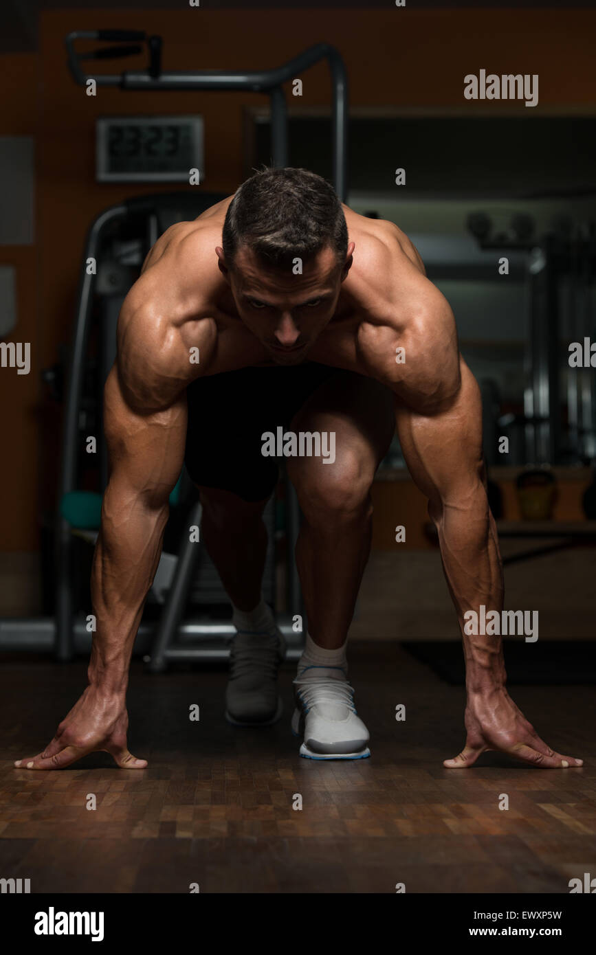 Strong muscular men kneeling on hi-res stock photography and images - Alamy