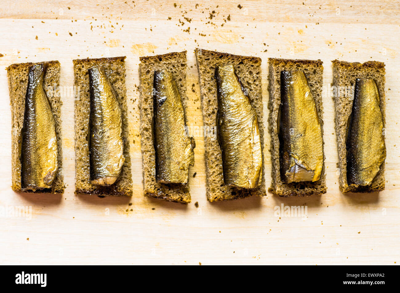 Appetizer with fish on a slice of bread on top of the form for the ...