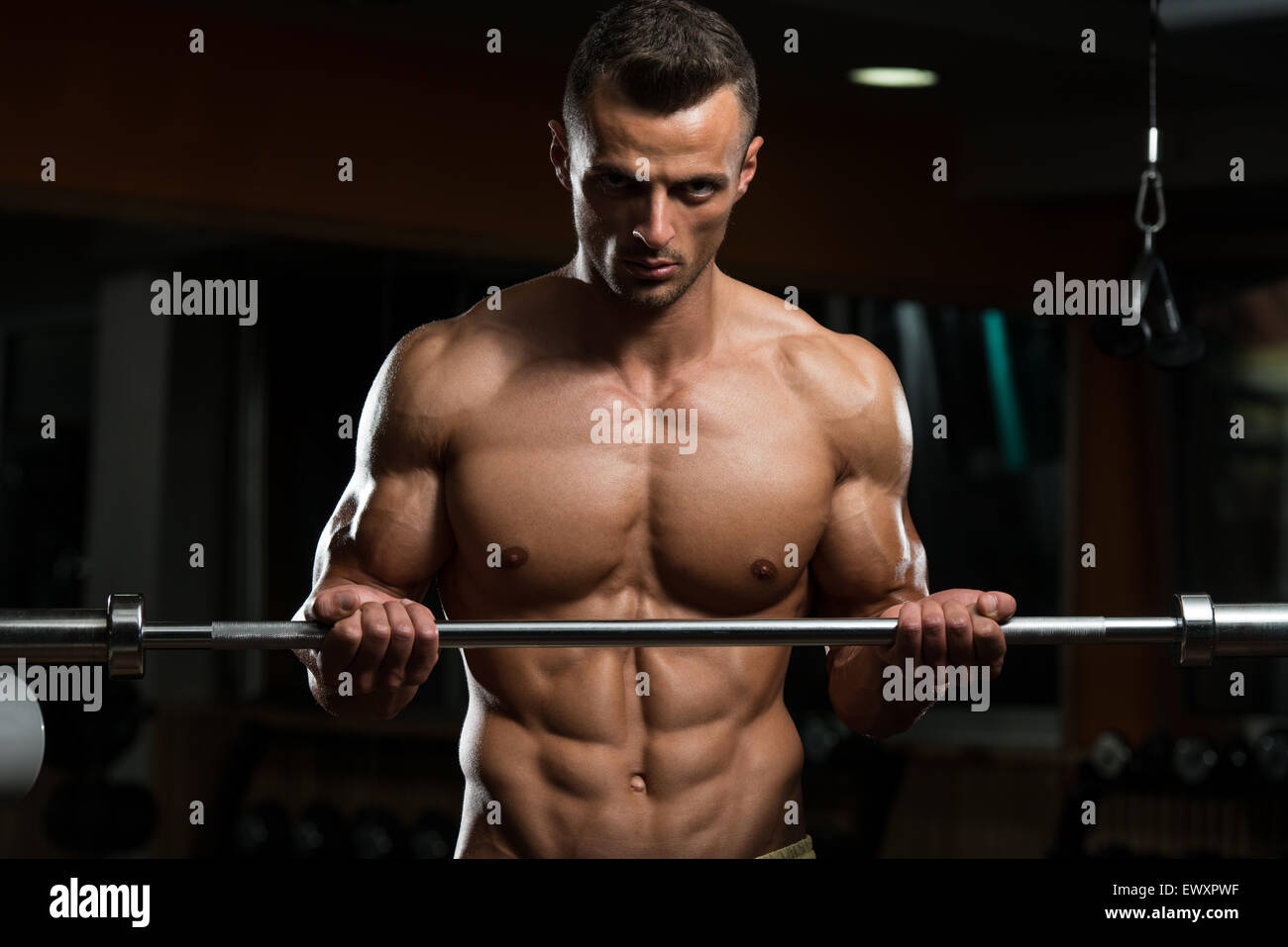 Muscular Man Doing Heavy Weight Exercise For Biceps Stock Photo - Alamy