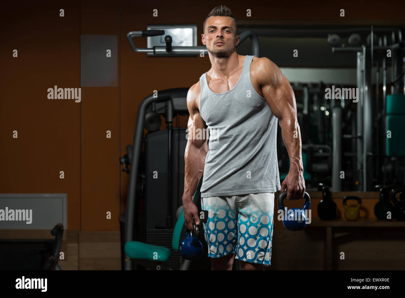 Muscular Man Exercise With Kettle Bell Stock Photo - Alamy