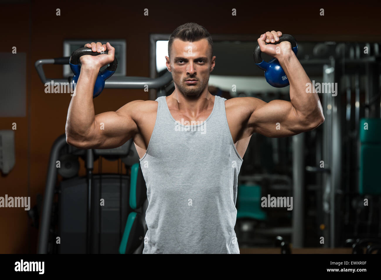 Muscular Man Exercise With Kettle Bell Stock Photo - Alamy