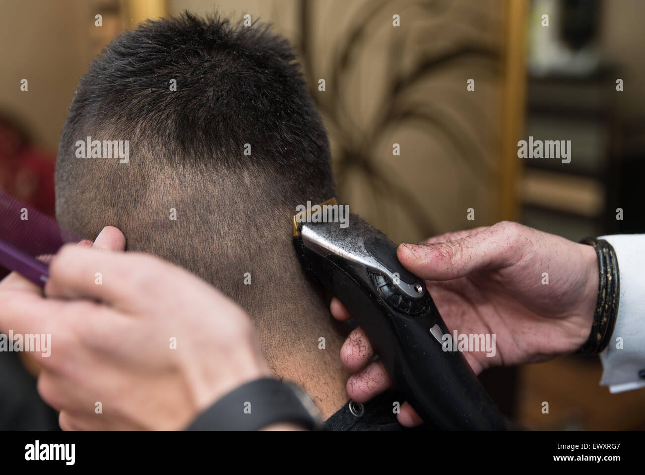 Handsome Young Hairdresser Giving A New Haircut To Male Customer At ...