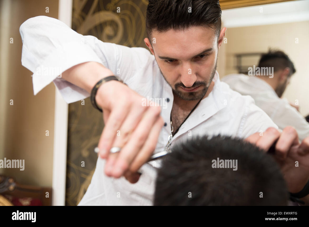 Handsome Young Hairdresser Giving A New Haircut To Male Customer At ...