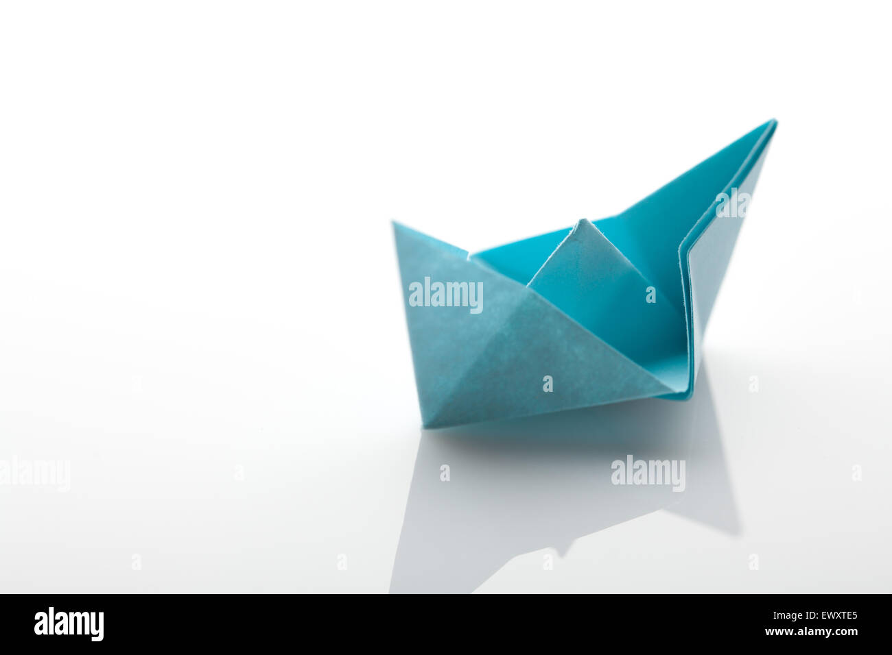 Origami paper ship on white background Stock Photo - Alamy