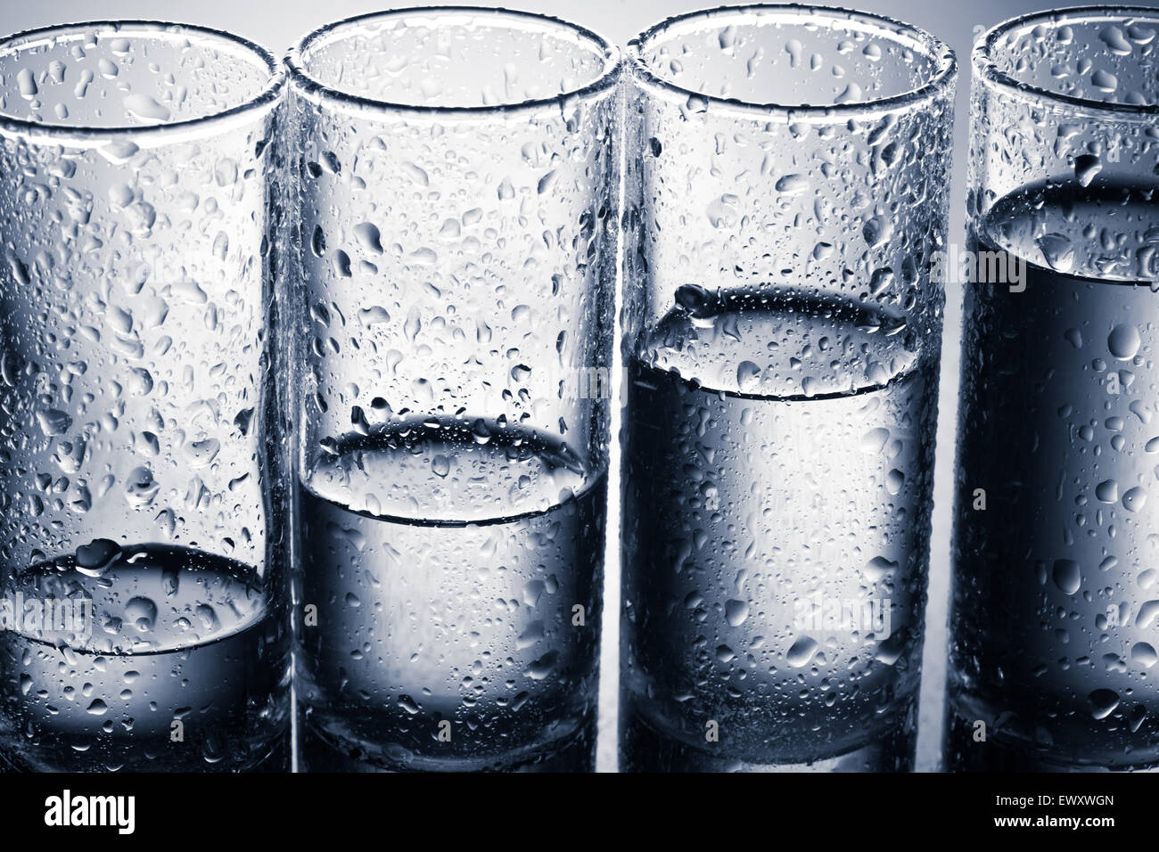 row of glasses for vodka Stock Photo - Alamy
