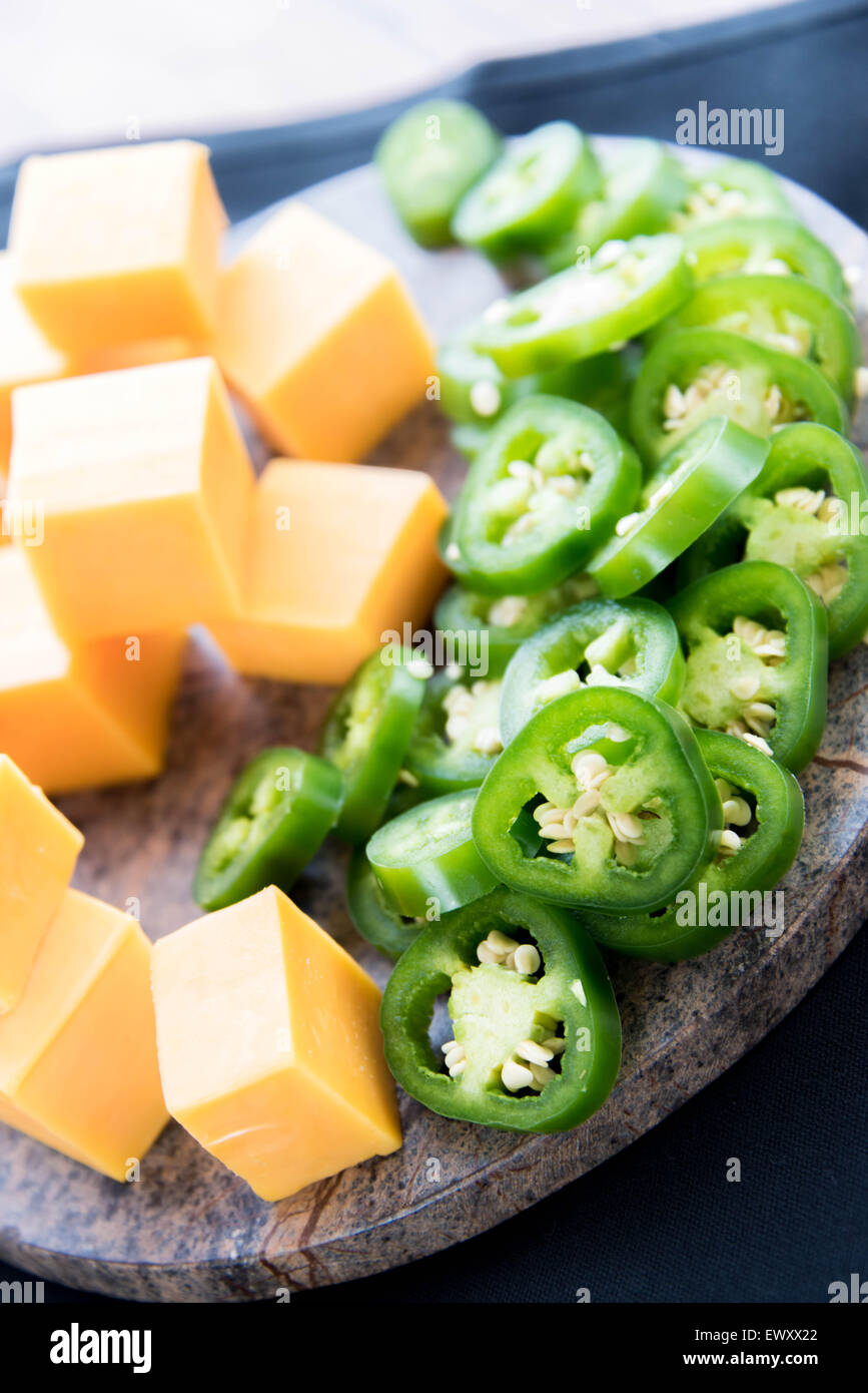fresh sliced jalapeno peppers and cheddar cheese Stock Photo - Alamy