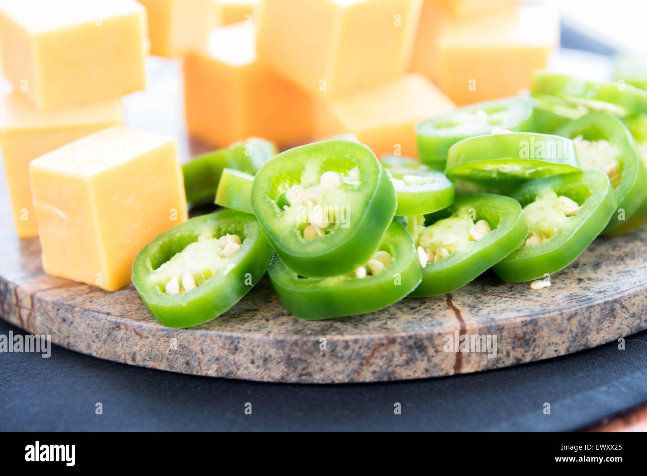 fresh sliced jalapeno peppers and cheddar cheese Stock Photo - Alamy